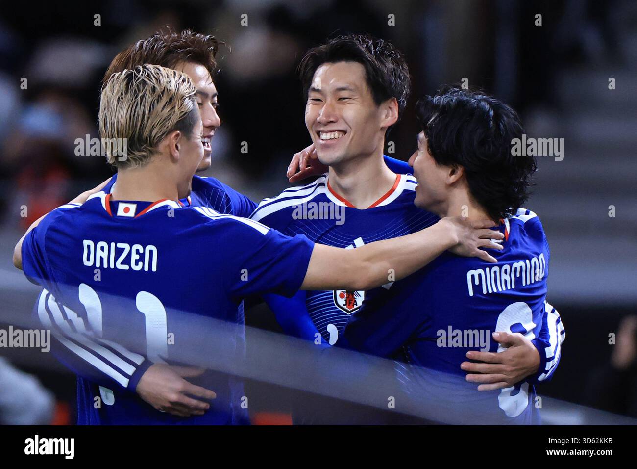 Daichi KAMADA of Japan (center) reacts after scoring a goal in the ...