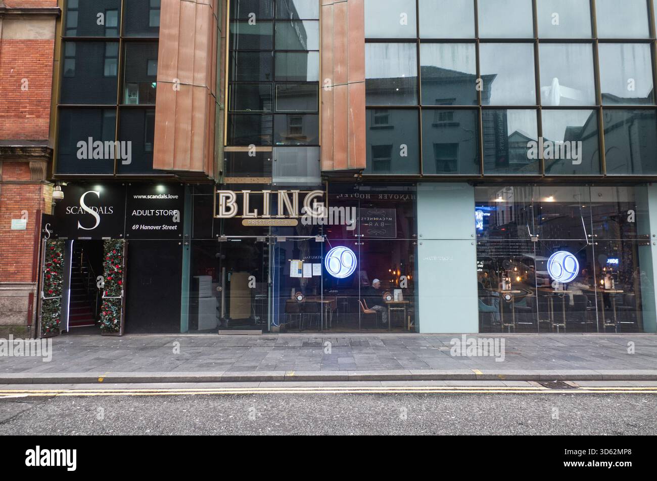 The modern, reflective glass and copper-toned facade of the Bling ...