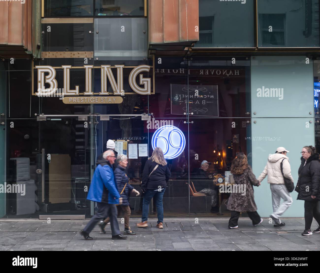 The modern, reflective glass and copper-toned facade of the Bling ...