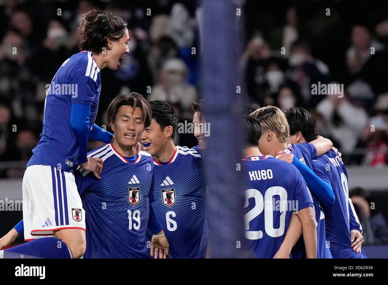 Japan players celebrate the opening goal against Bolivia during the ...