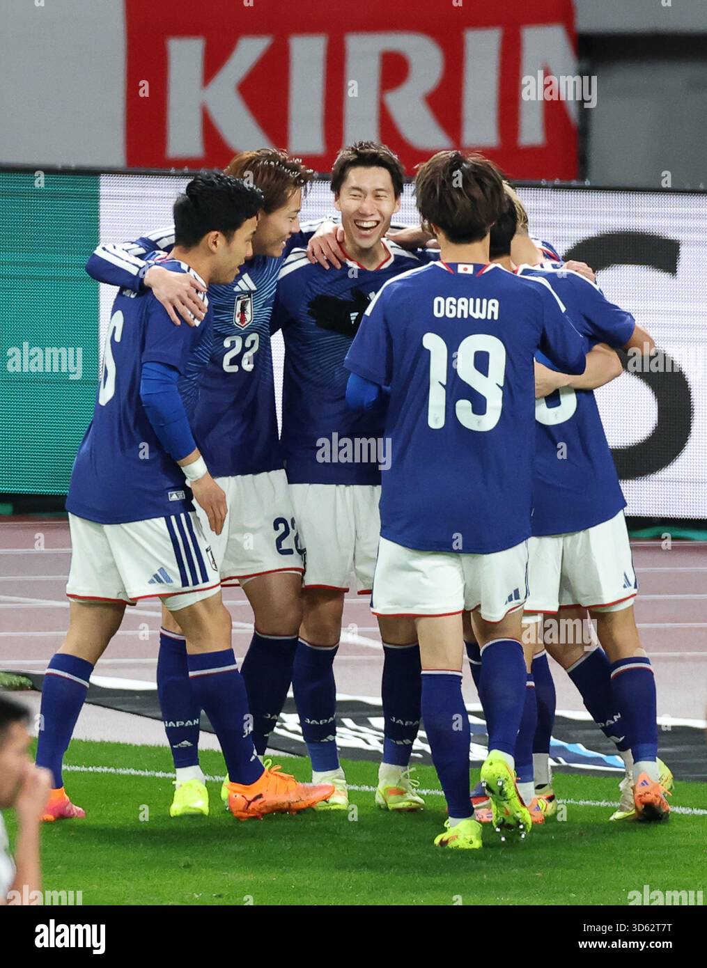 Daichi KAMADA of Japan (center) reacts after scoring a goal in the ...
