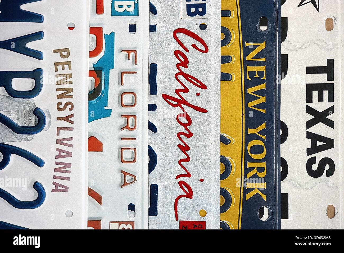 Old US car license plates with various state names close up. Concept of ...