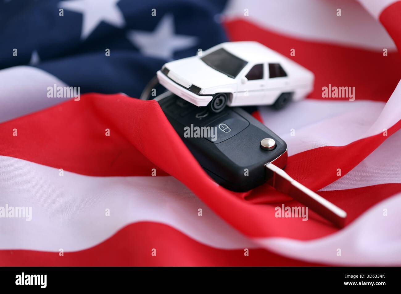 Ignition keys with remote control buttons and toy car on United States ...