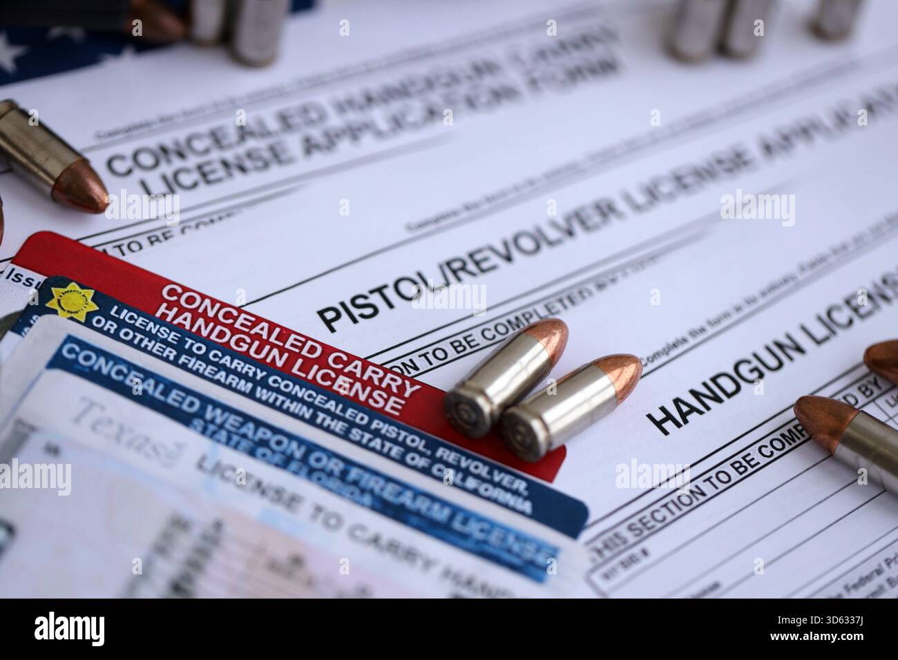 USA firearms license and handgun with bullets on US Constitution. Gun ...