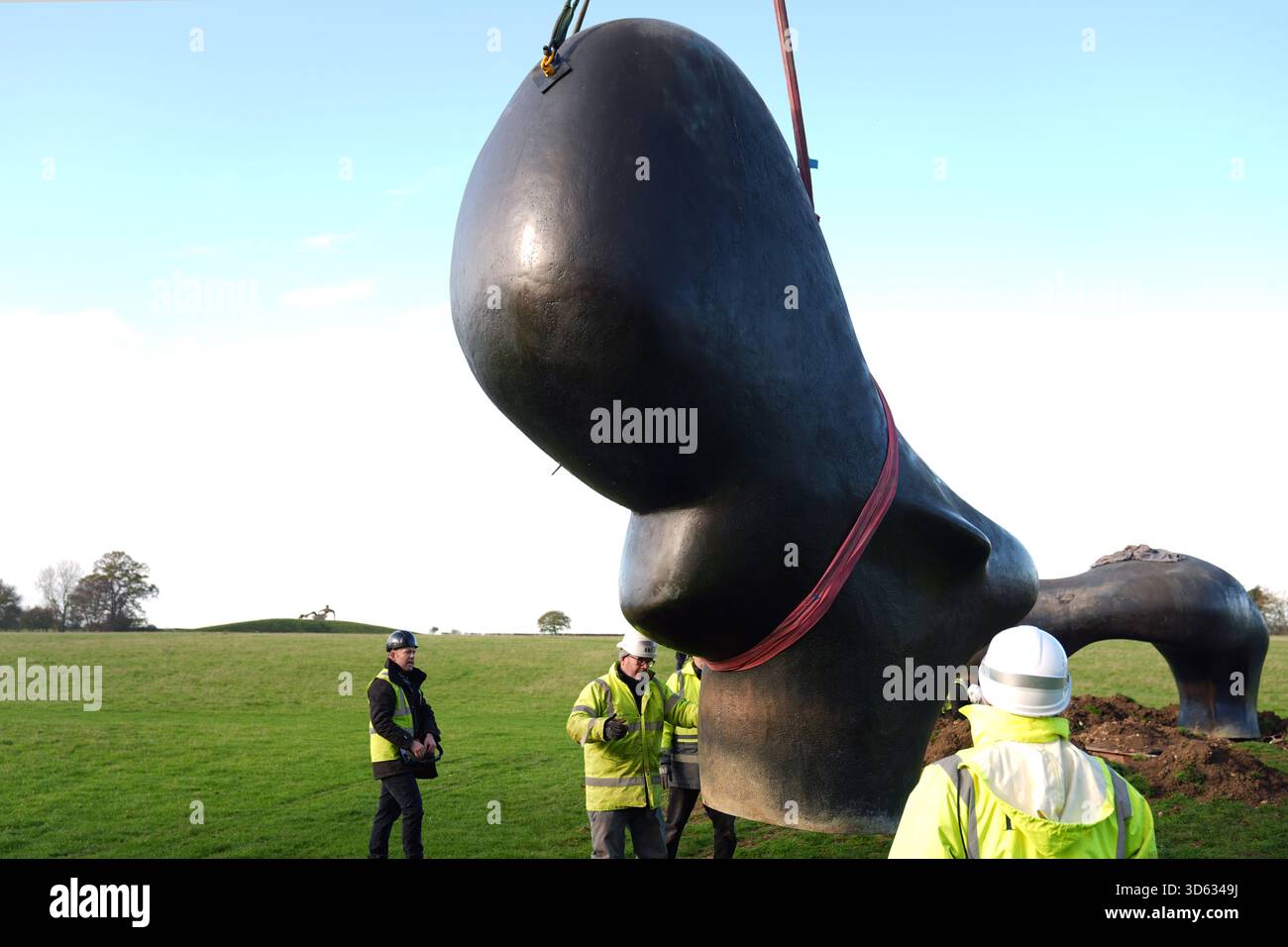Workers use a crane to remove the Henry Moore bronze sculpture Sheep ...