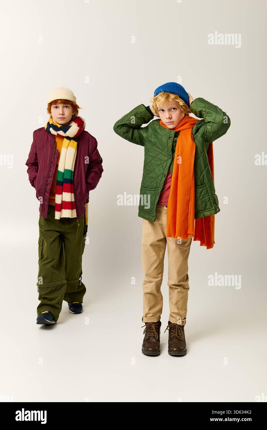 Two trendy kids showcase their unique styles while enjoying a playful ...
