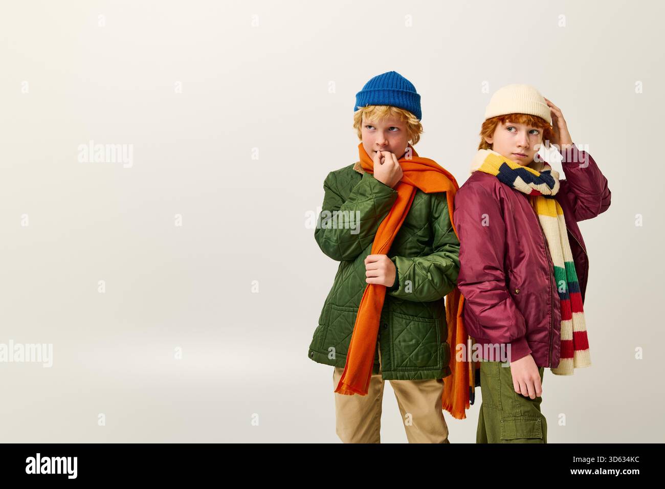 Two children express their unique style through colorful winter outfits ...
