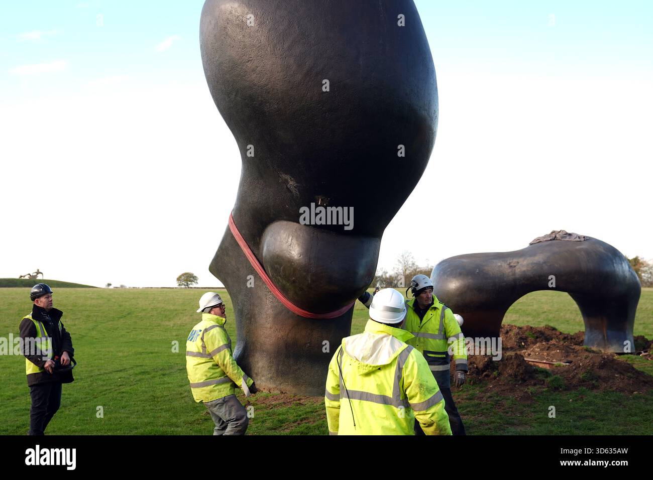 Workers use a crane to remove the Henry Moore bronze sculpture Sheep ...