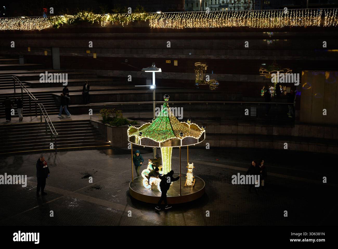Christmas lighting is seen near a shopping mall in Warsaw, Poland on 16 ...
