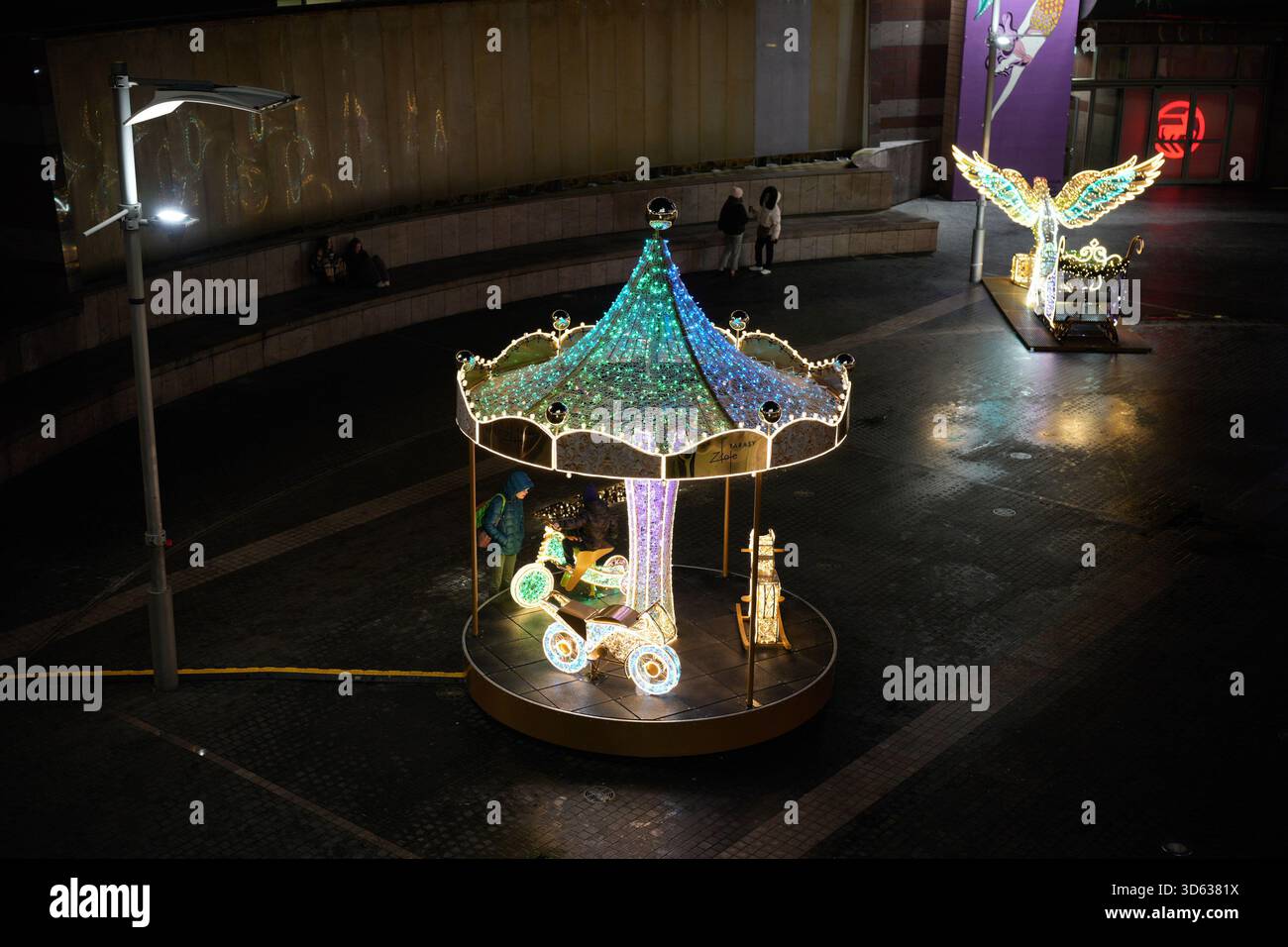 Christmas lighting is seen near a shopping mall in Warsaw, Poland on 16 ...