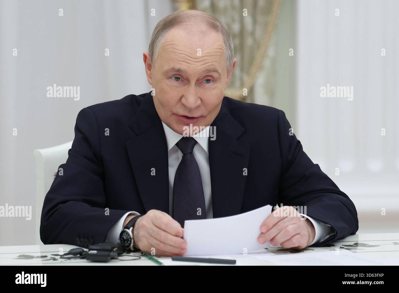 Russian President Vladimir Putin speaks with Chinese Premier Li Qiang ...