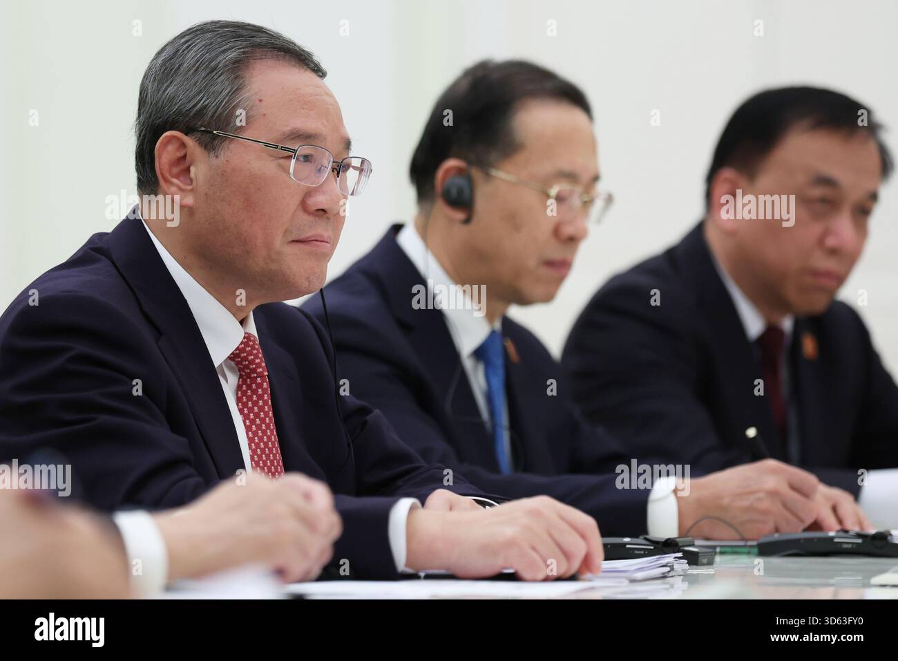 Chinese Premier Li Qiang, left, attends a meeting with Russian ...