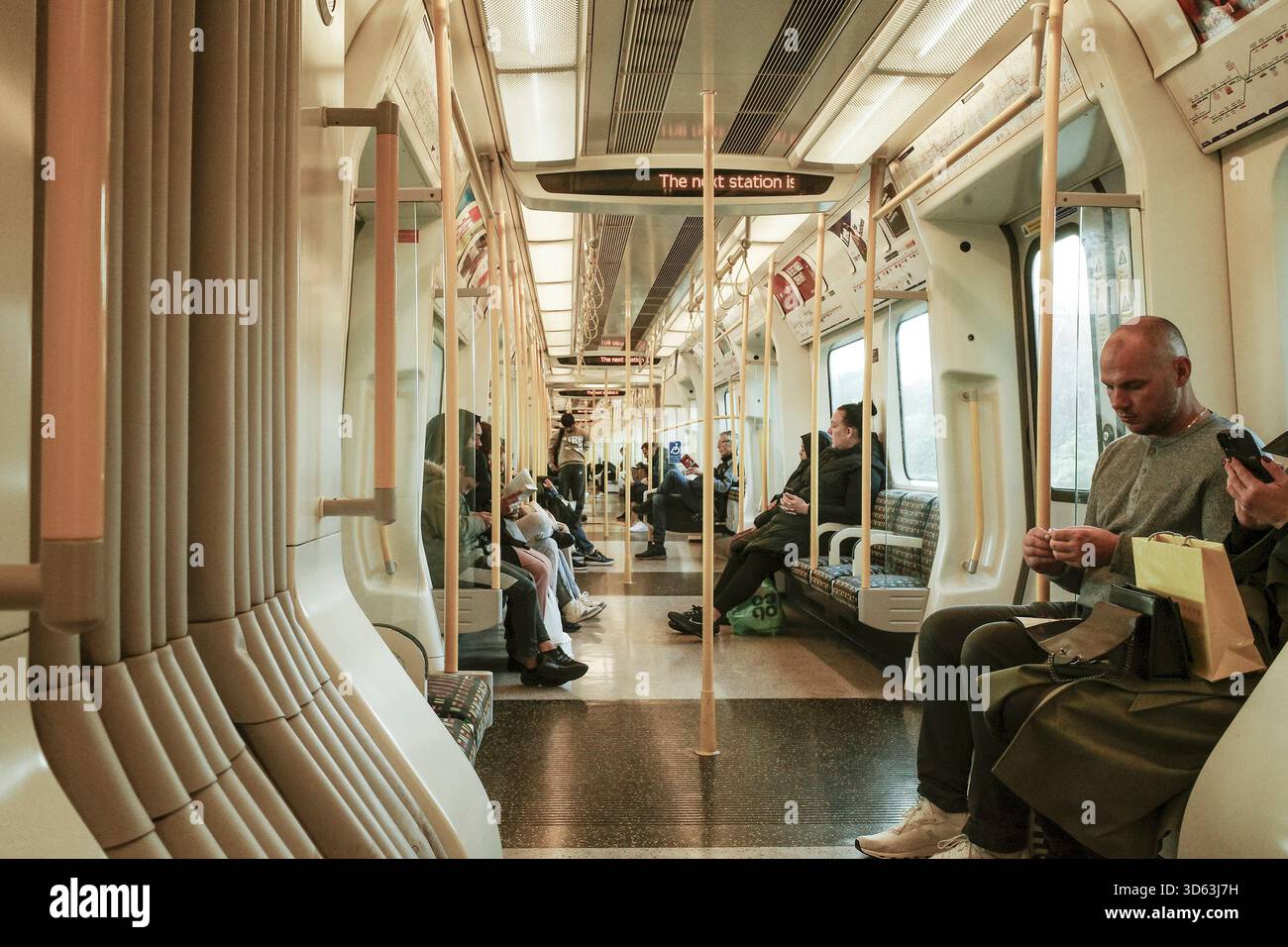 Passengers on a District Line tube train in the UK in Europe Stock ...