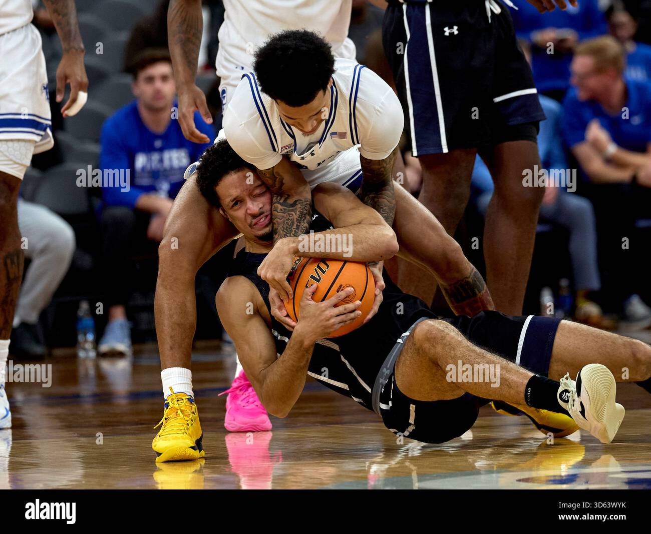 Seton Hall Pirates guard Adam Clark (0) ties up Monmouth Fighting Scots ...