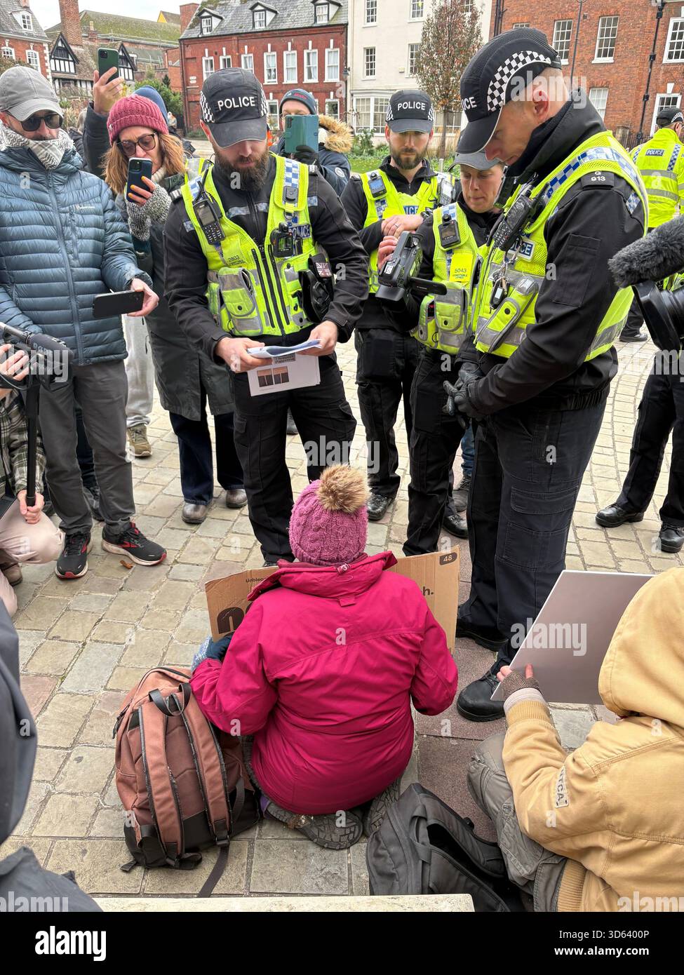 Police prepare to remove a protester after protesters gathered in ...