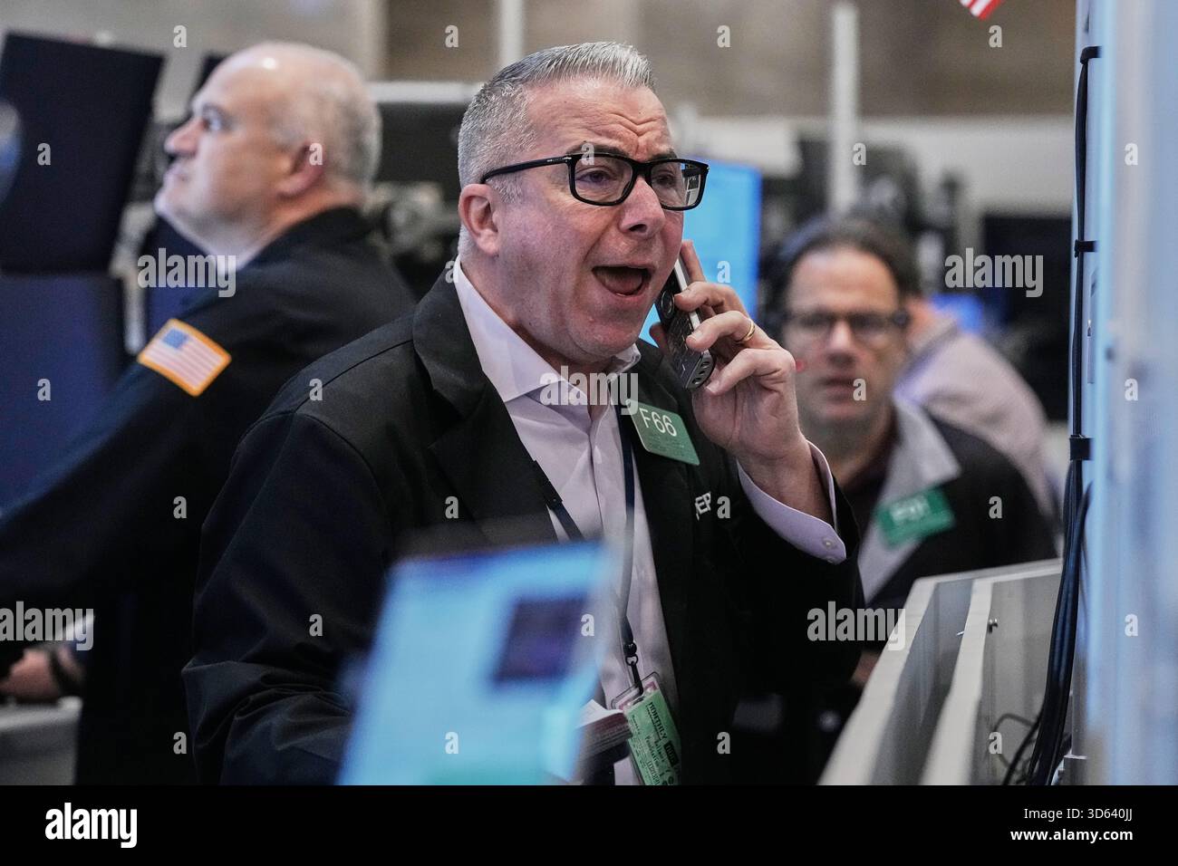 Options trader Joseph D'Arrigo works on the floor of the New York Stock ...
