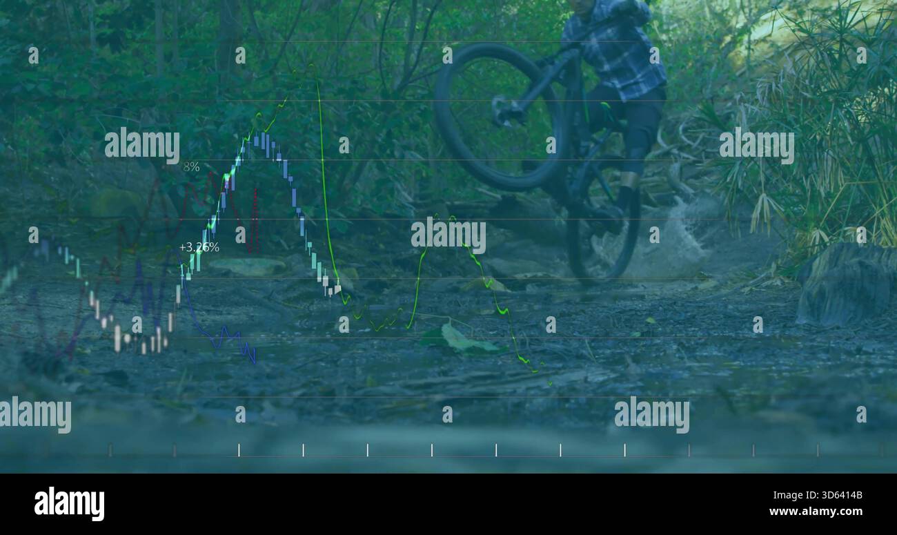 Riding man on bike lifting wheel over muddy stream on trail, plaid ...