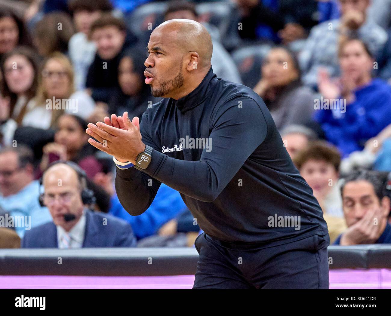 Seton Hall head coach Shaheen Holloway cheers his team against Monmouth ...