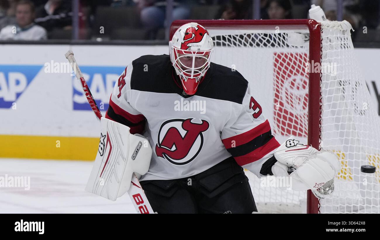 New Jersey Devils goaltender Jake Allen deflects a shot during the ...