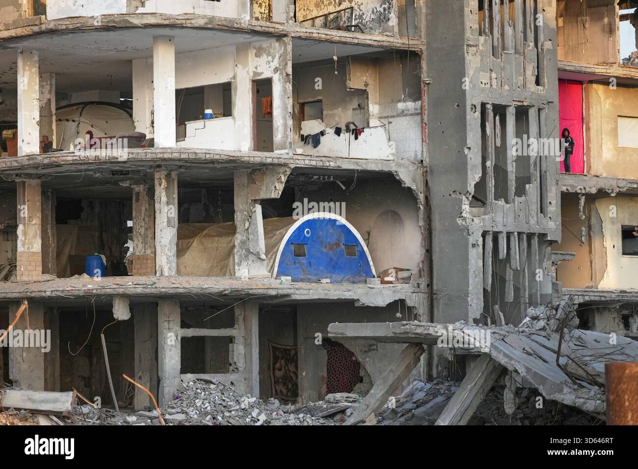 Tents are set up inside a gutted apartment building in Al-Shati camp in ...