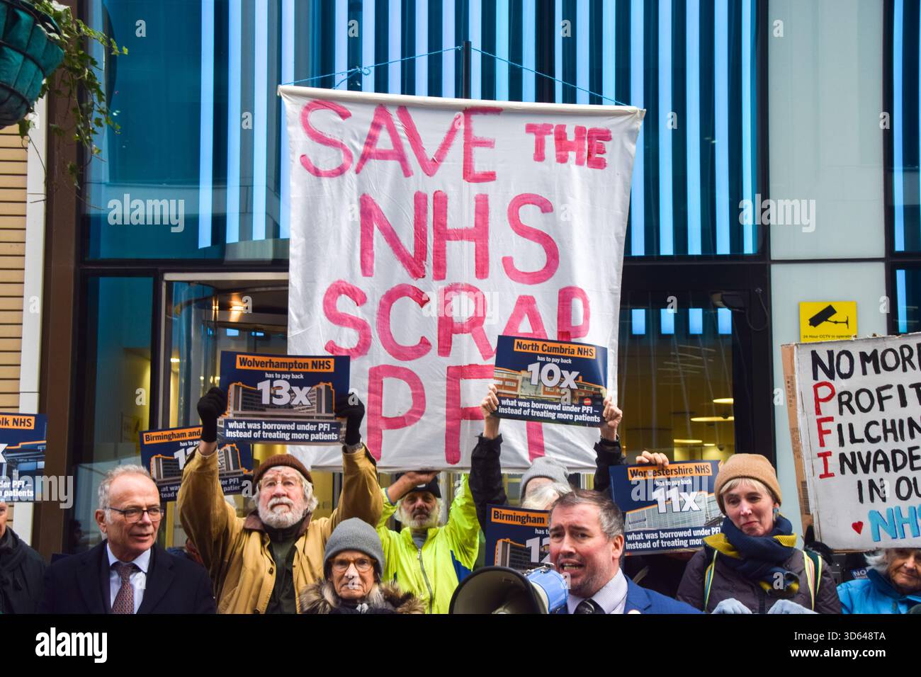 London, UK. 18th November 2025. Campaigners from We Own It stage a ...
