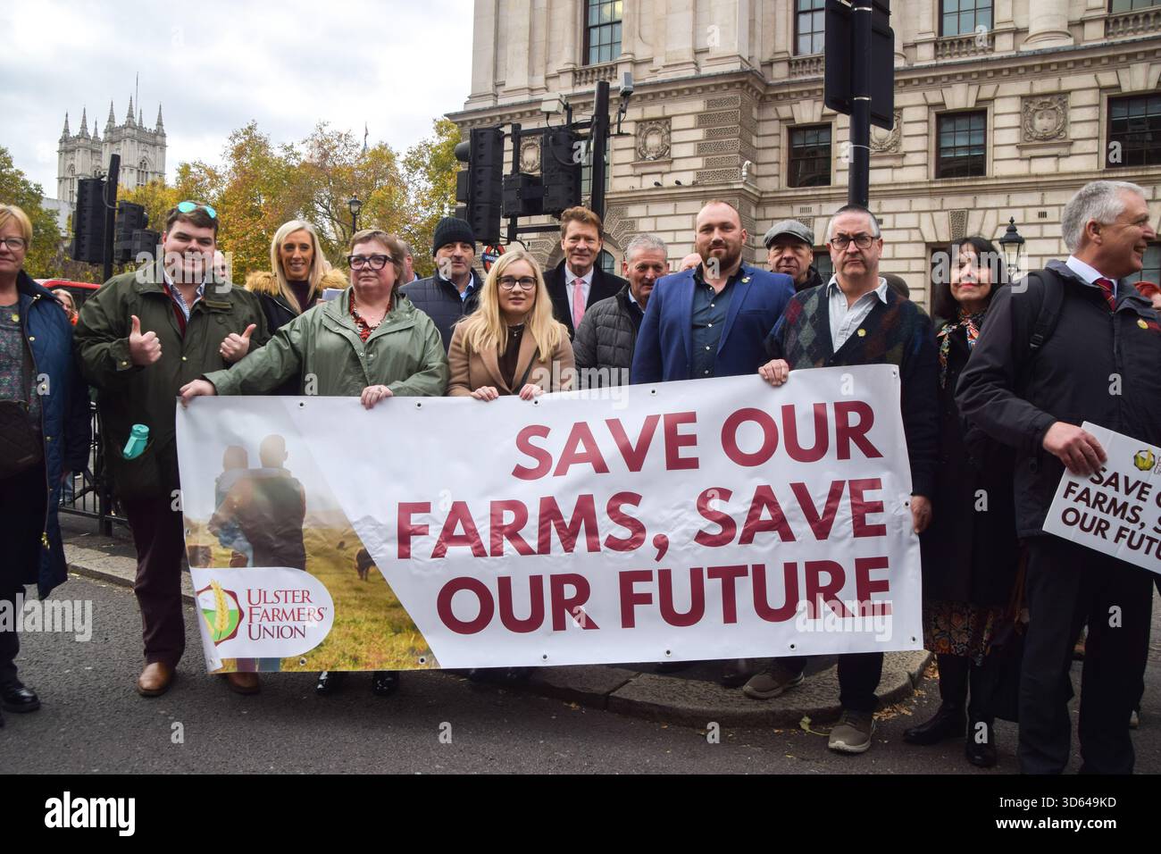 Farmers hold a 'Save our farms, save our future' banner during a ...