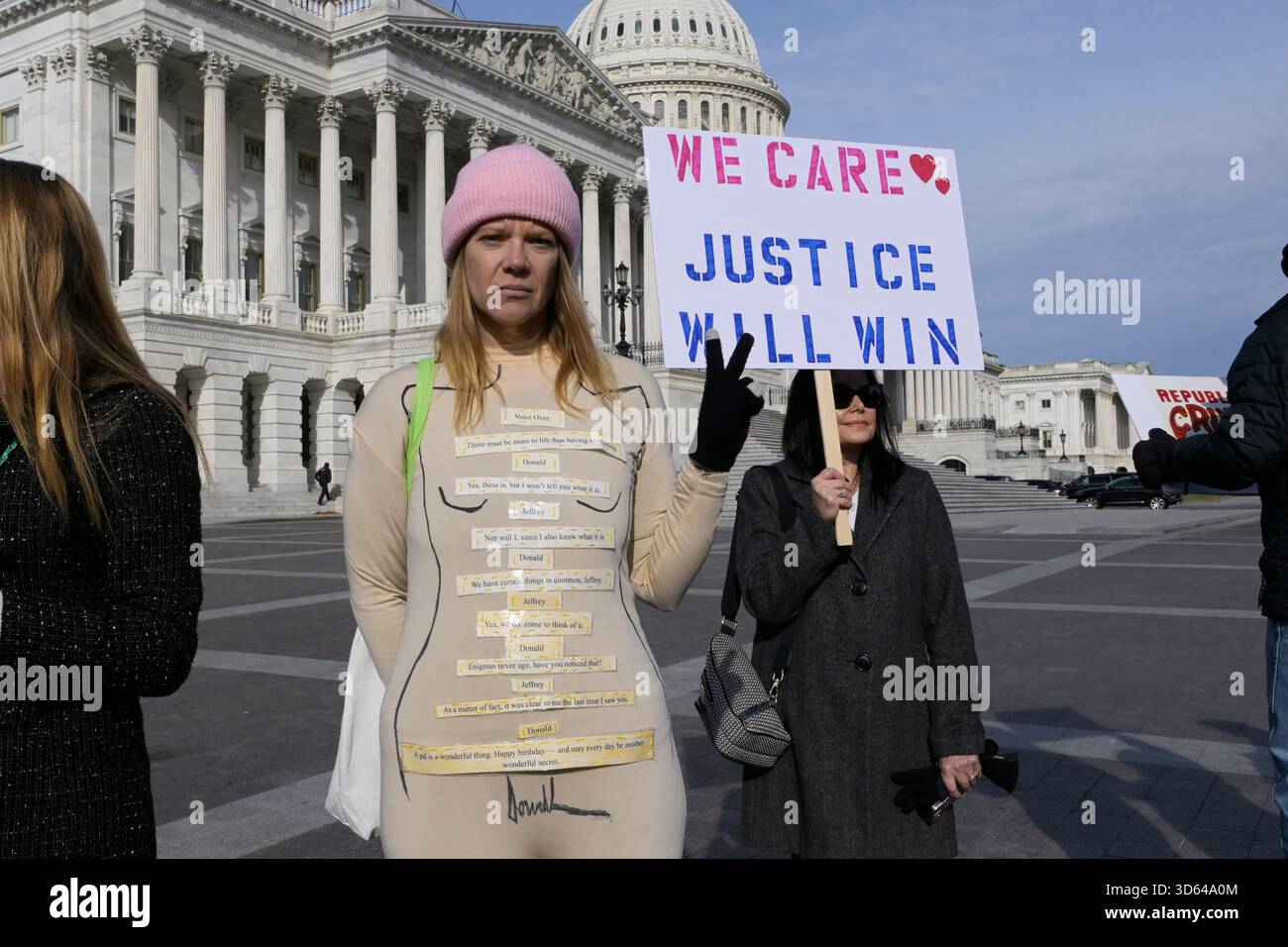 Demonstrator hold a signs during Epstein Files Transparency Act news ...