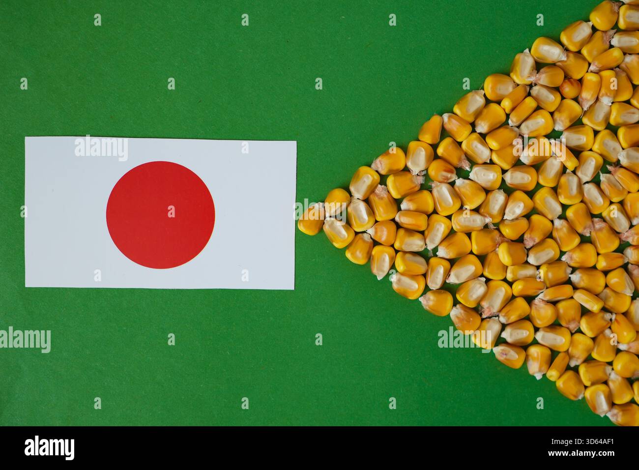 Yellow corn kernels in the shape of the Brazilian flag on a green ...