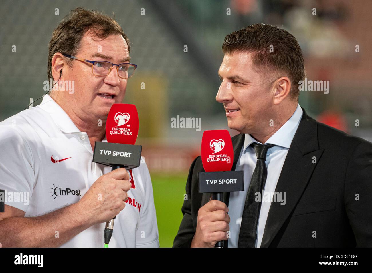 Polish TV commentator Mateusz Borek taklks with Coach Jan Urban of ...