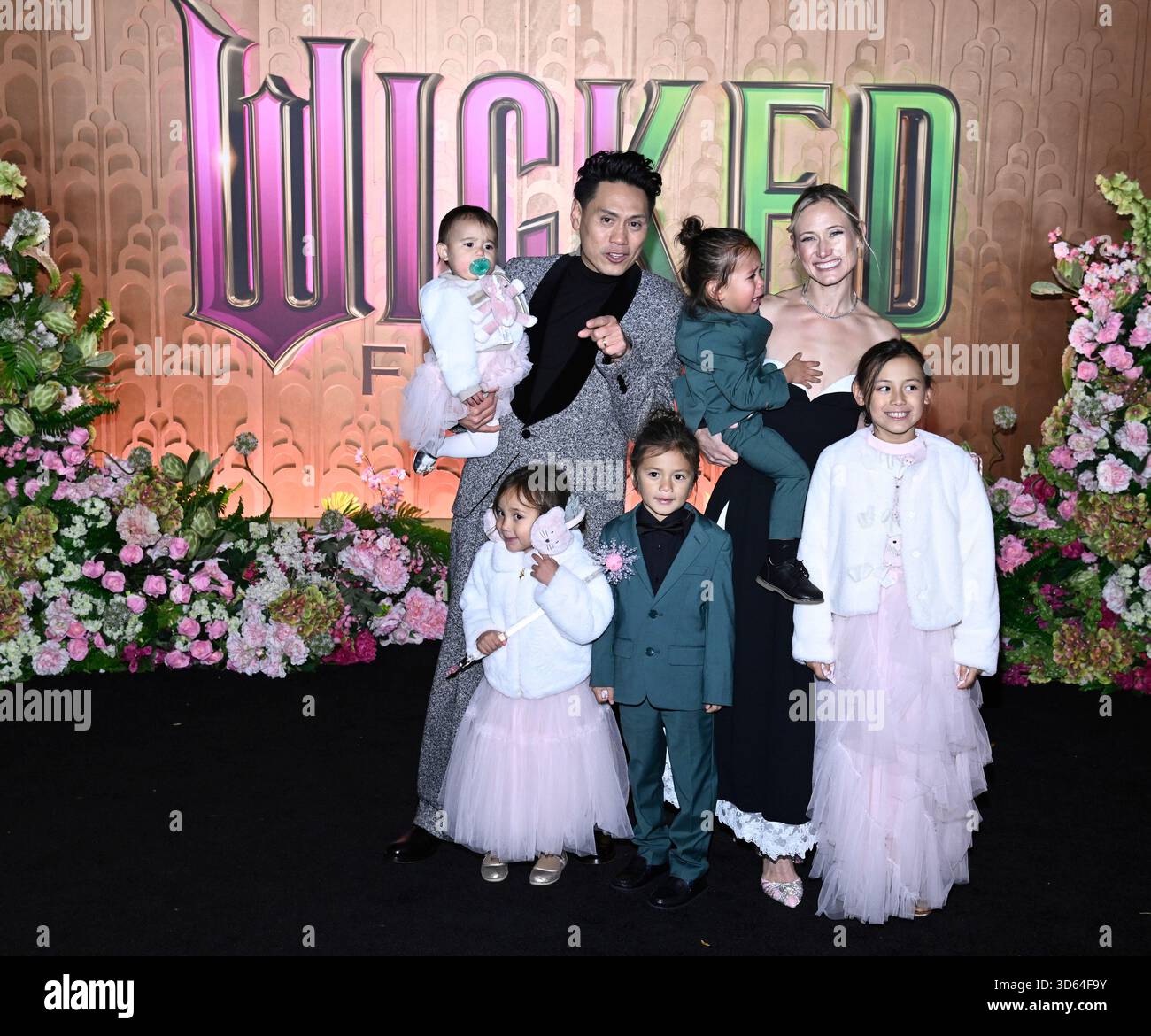 Director Jon M. Chu and family walking the red carpet at 'Wicked: For ...