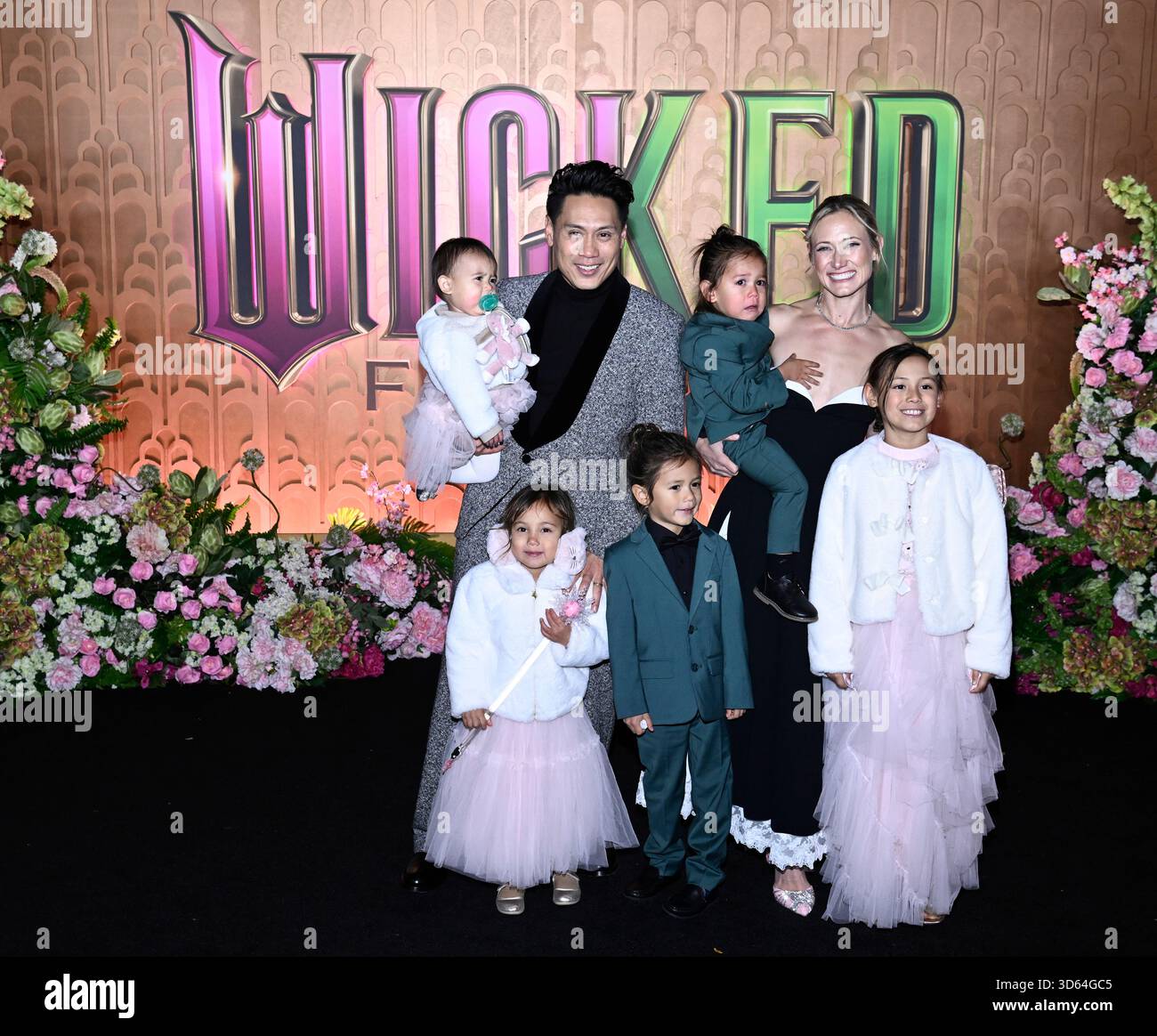 Director Jon M. Chu and family walking the red carpet at 'Wicked: For ...