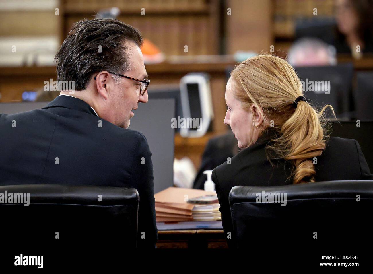 Defense attorney Kelli Porges, right, confers with her client, murder ...