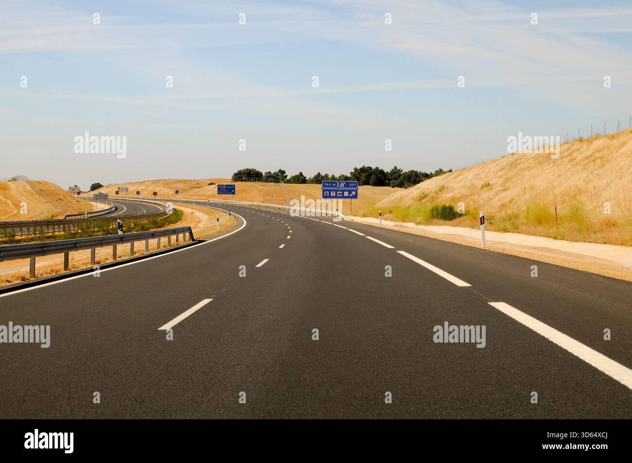 Empty paved road with exit signs in Europe Stock Photo - Alamy