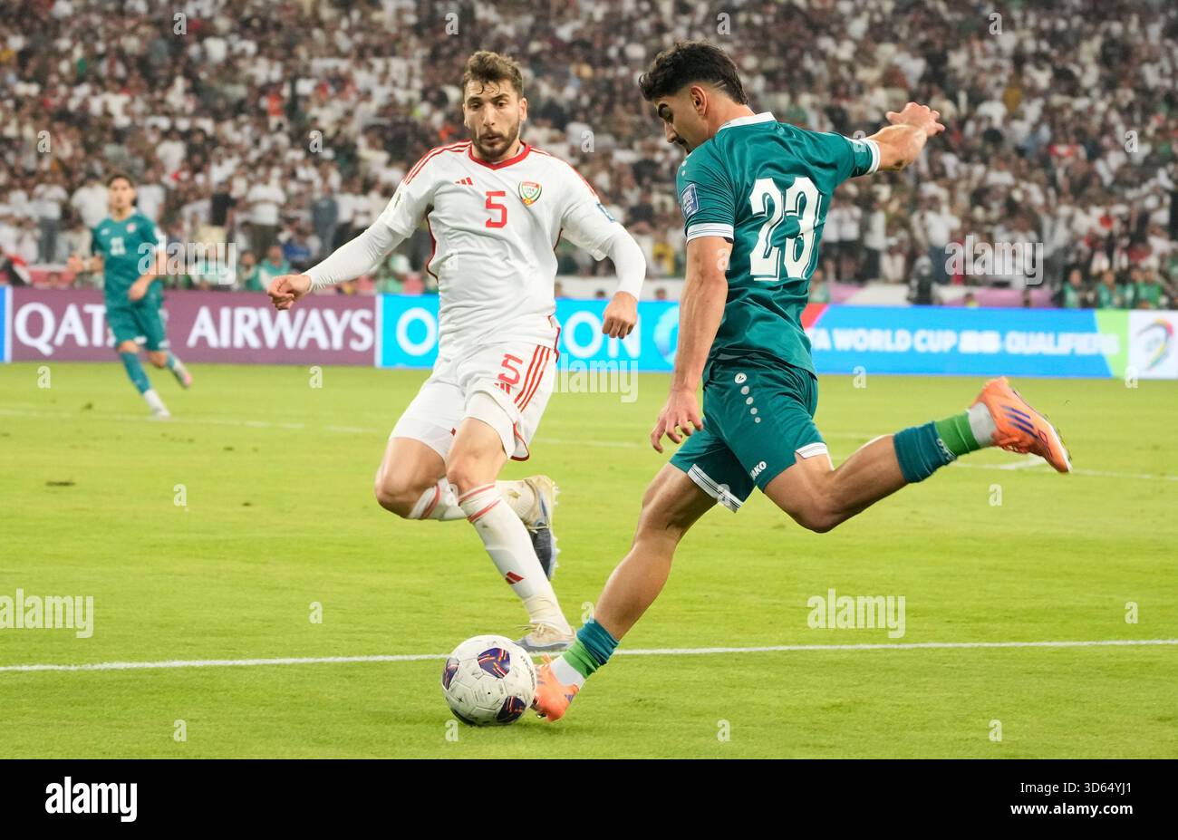 Iraqi's Merchas Doski, right, fights for the ball during the 2026 World Cup play off second leg ...
