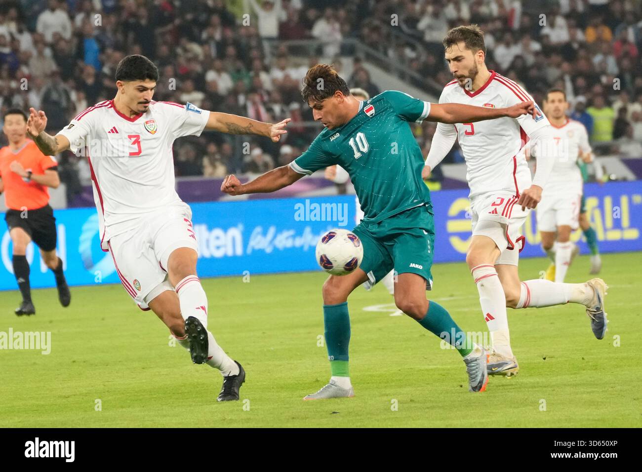 Iraqi's Mohanad Ali, centre, and UAE's Lucas Pimenta, left, challenge ...