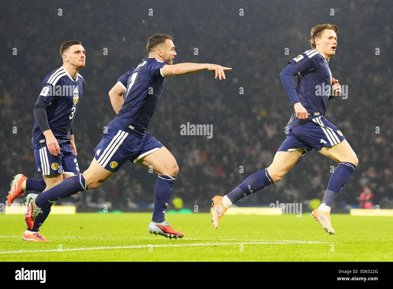 Scotland's Scott McTominay (right) celebrates scoring their side's ...
