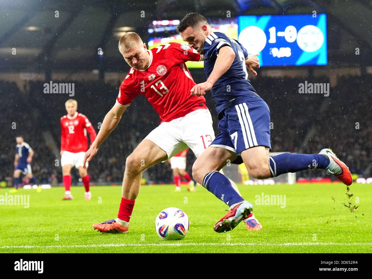 Denmark's Rasmus Kristensen (left) and Scotland's John McGinn battle ...