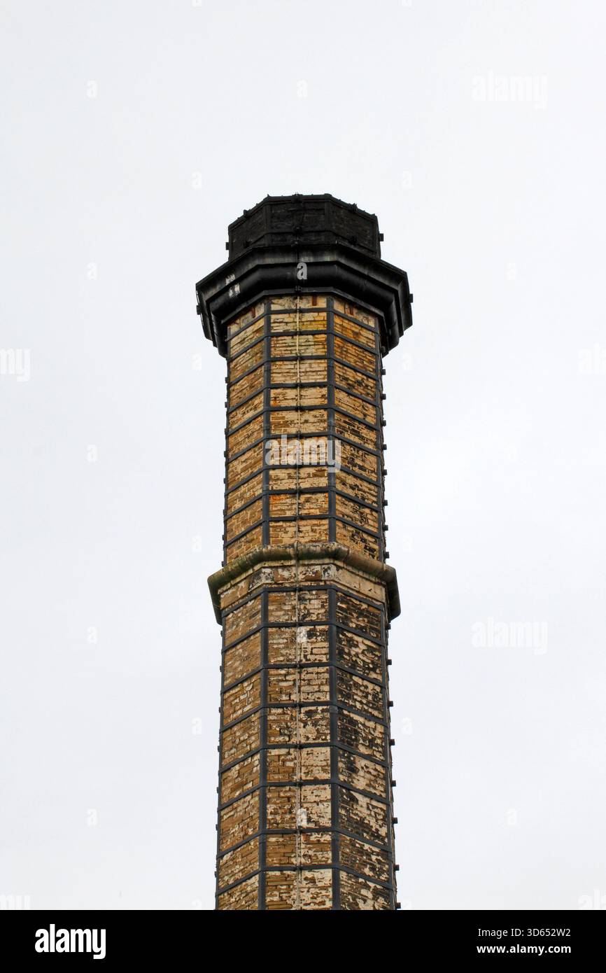 Tall brick factory chimney with metal bracing. Nestle factory, Halifax ...