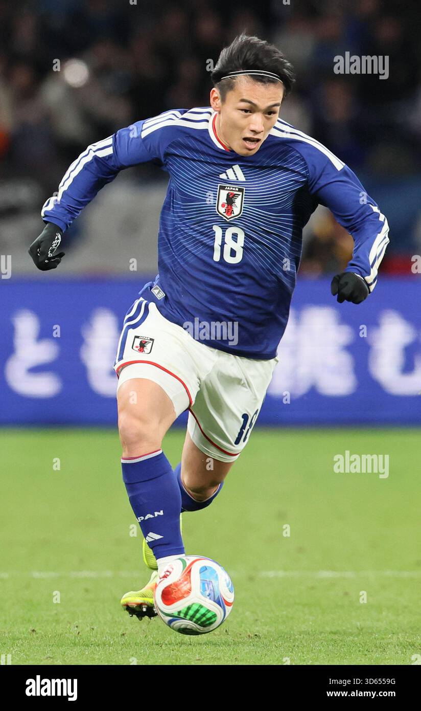 November 18, 2025, Tokyo, Japan - Japan's forward Ayase Ueda carries ...