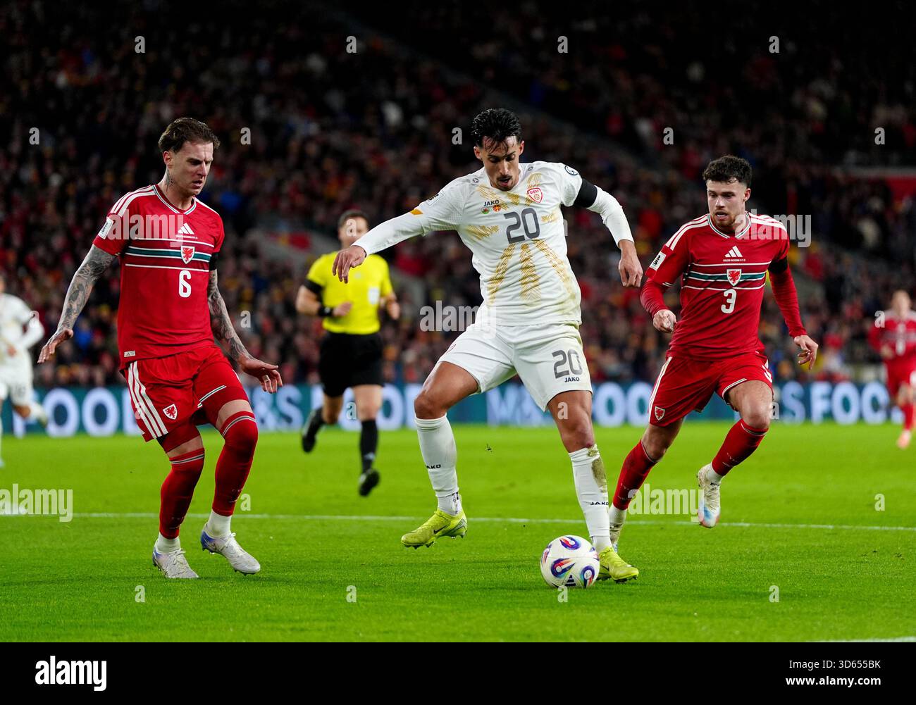 North Macedonia's Bojan Miovski (centre) and Wales' Joe Rodon (left ...