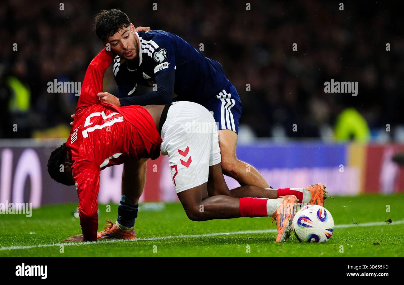 Scotland's Aaron Hickey and Denmark's Patrick Dorgu battle for the ball ...