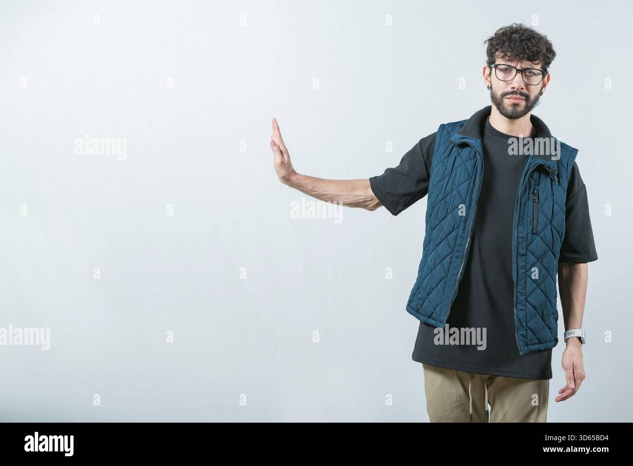 Serius guy making rejection gesture with palm of hand isolated ...