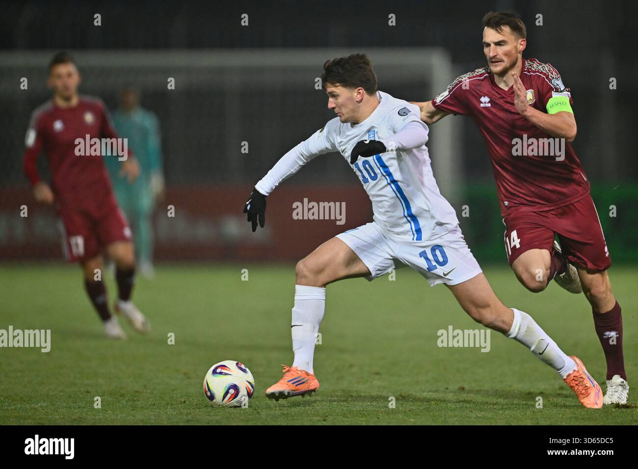 Greece's Christos Tzolis in action in front of Belarus' Evgeni ...