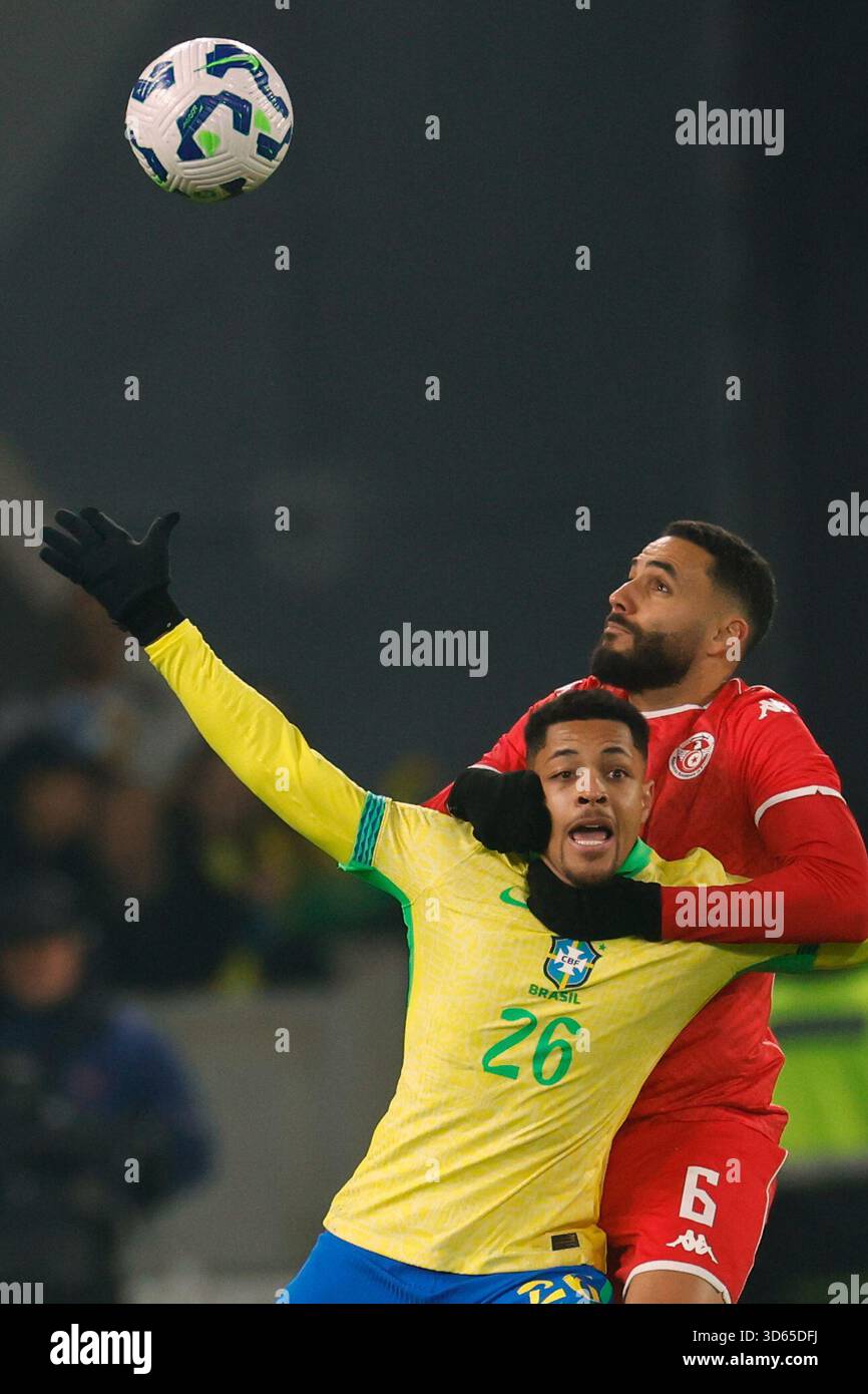 Brazil's Vitor Roque front, and Tunisia's Bronn battle for the ball ...