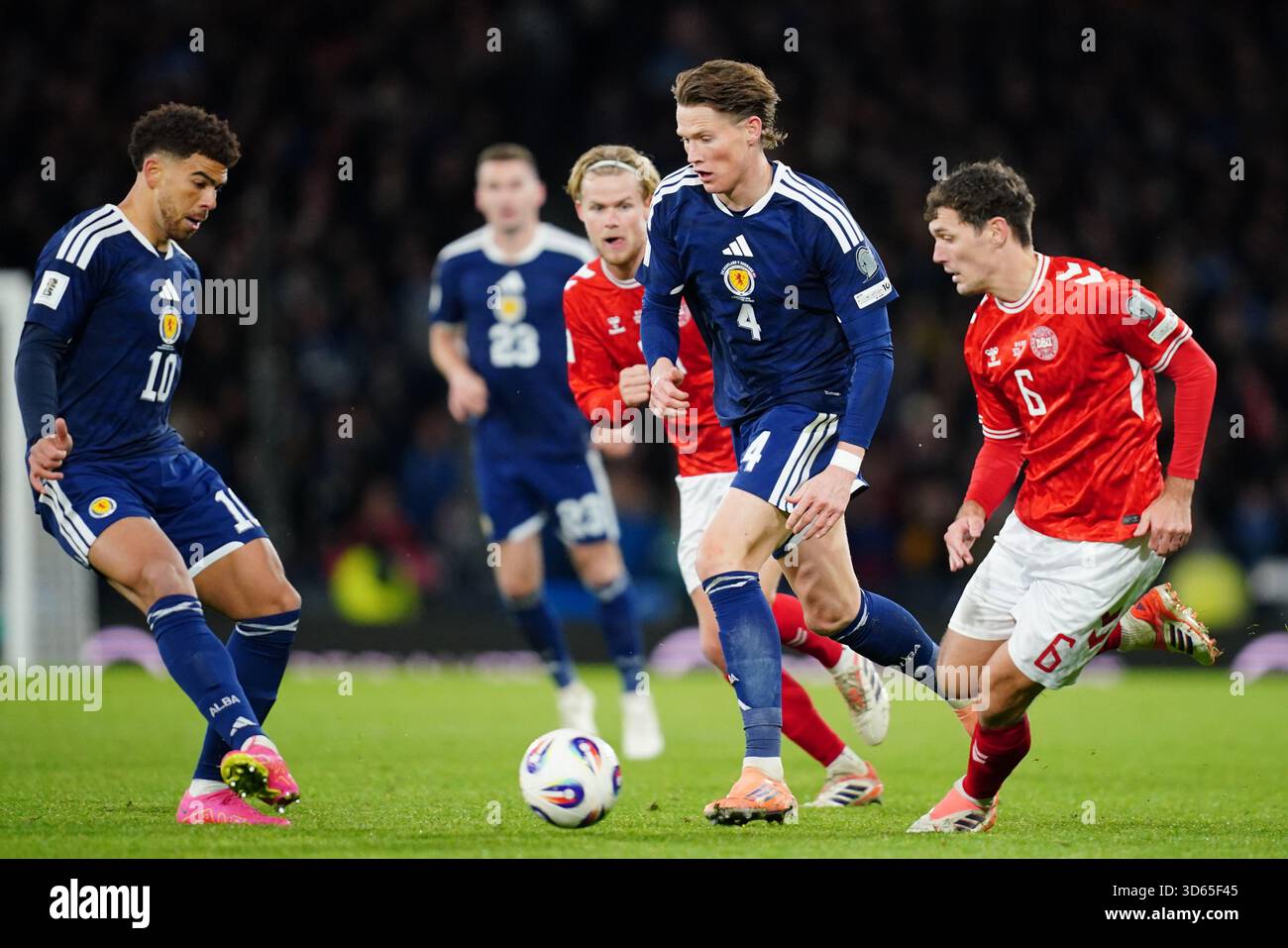 Scotland's Scott McTominay (centre) and Denmark's Andreas Christensen ...