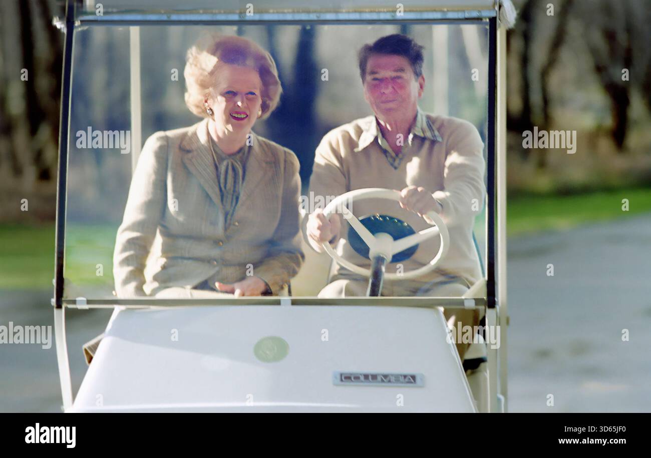 U.S. President Ronald Reagan driving golf cart with British Prime ...
