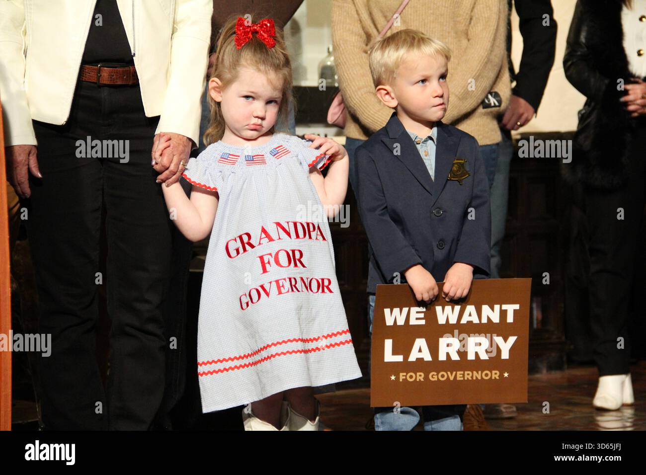 Gov. Larry Rhoden's grandchildren look on as he announces his run for a ...