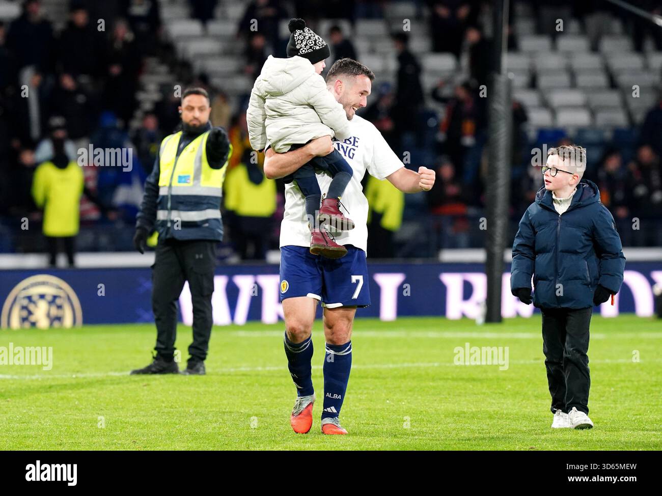 Scotland's John McGinn celebrates with his children after qualifying ...