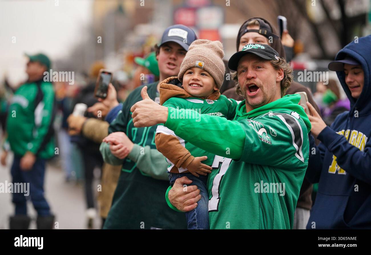 People cheer during a Grey Cup championship parade in Regina ...