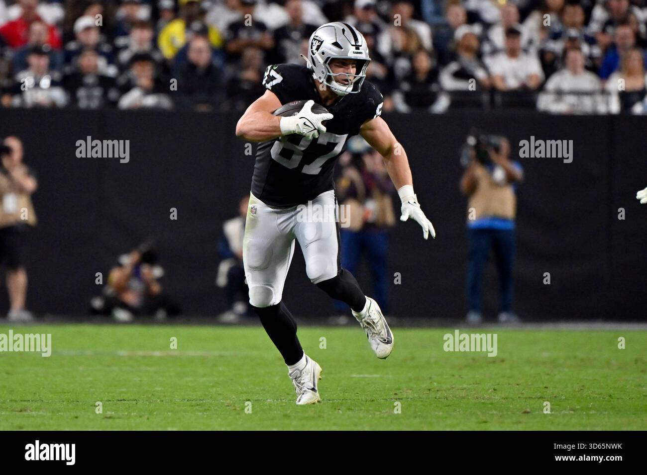 Las Vegas Raiders tight end Michael Mayer (87) runs with the ball ...